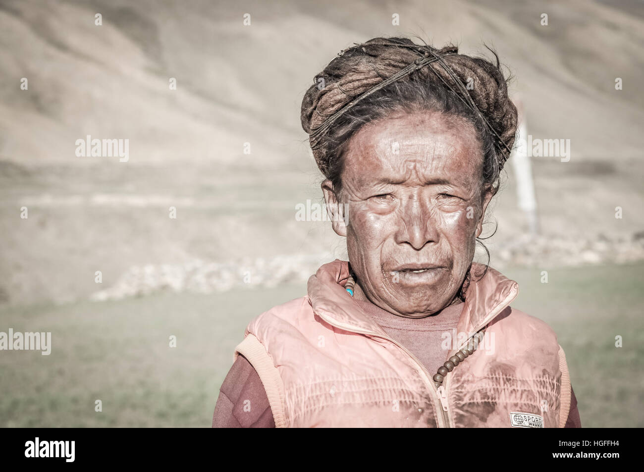 Dolpo, Nepal - circa June 2012: Old native woman with brown dreadlocks ...