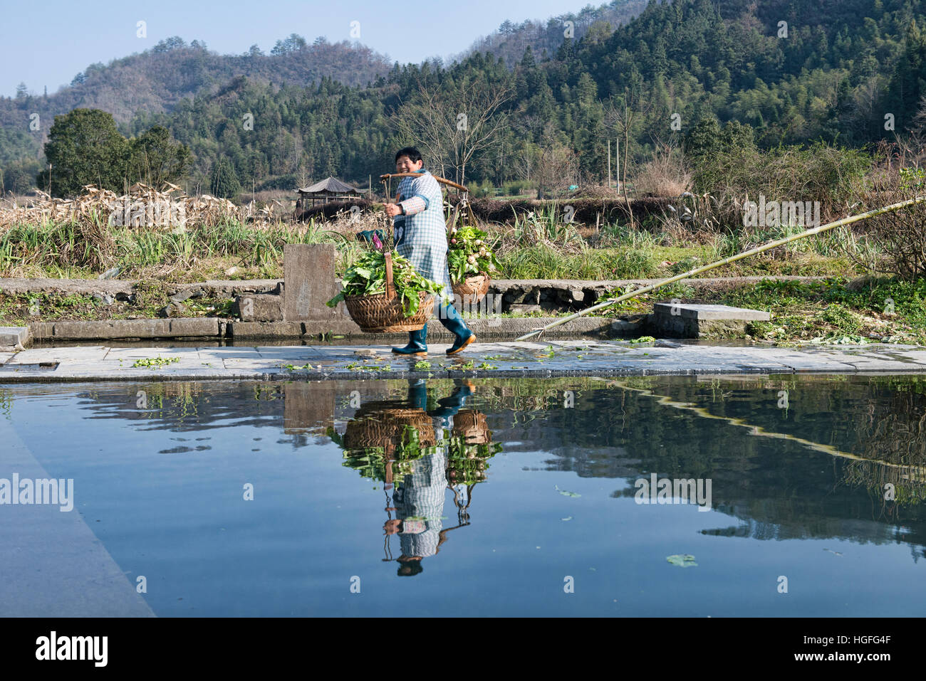 Washing vegetables in the ancient village of Xidi, Anhui, China Stock ...