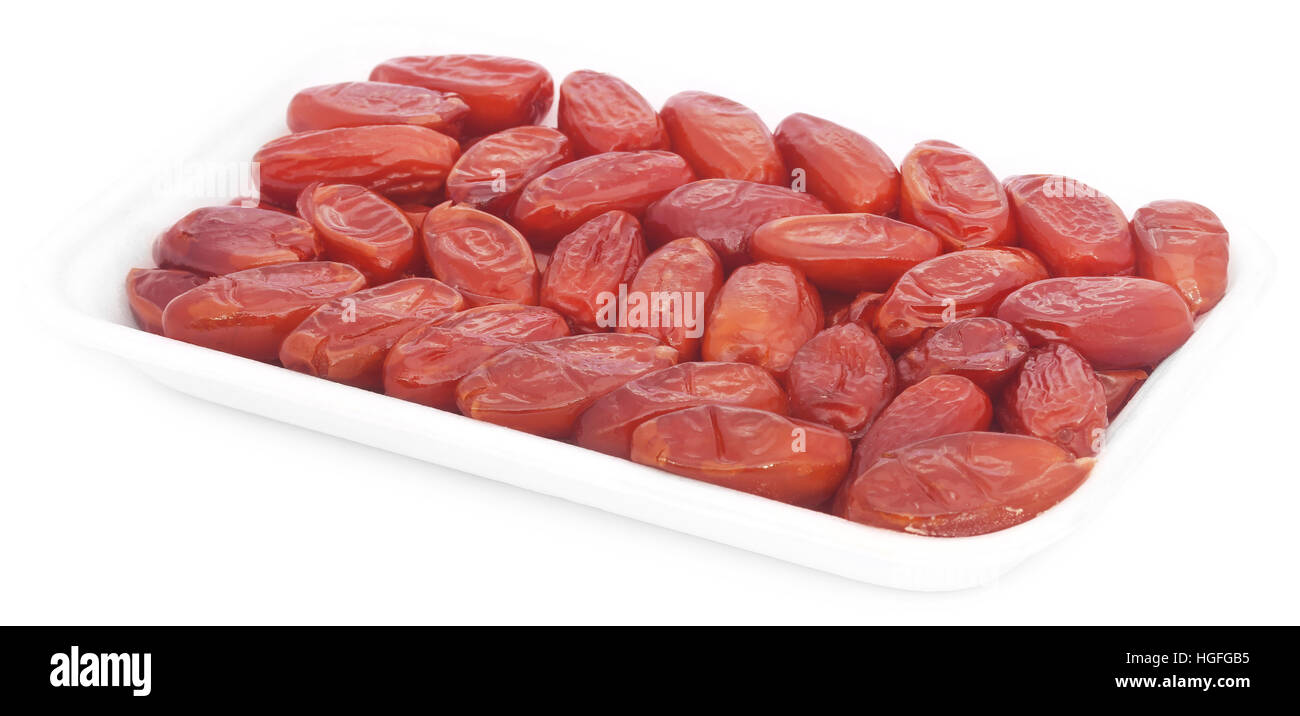 Arabian Dates in a white box over white background Stock Photo - Alamy