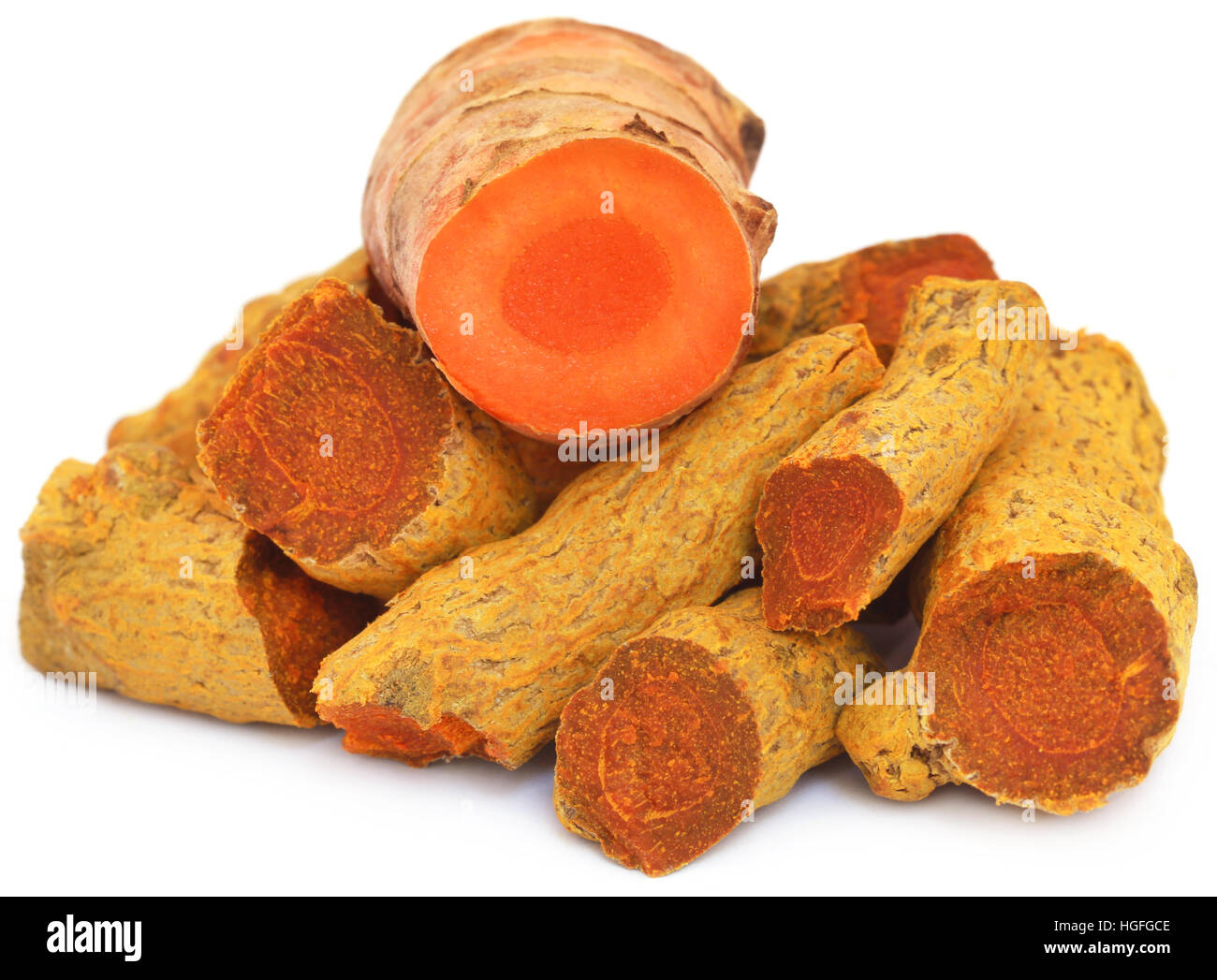 Dry turmeric over white background Stock Photo - Alamy