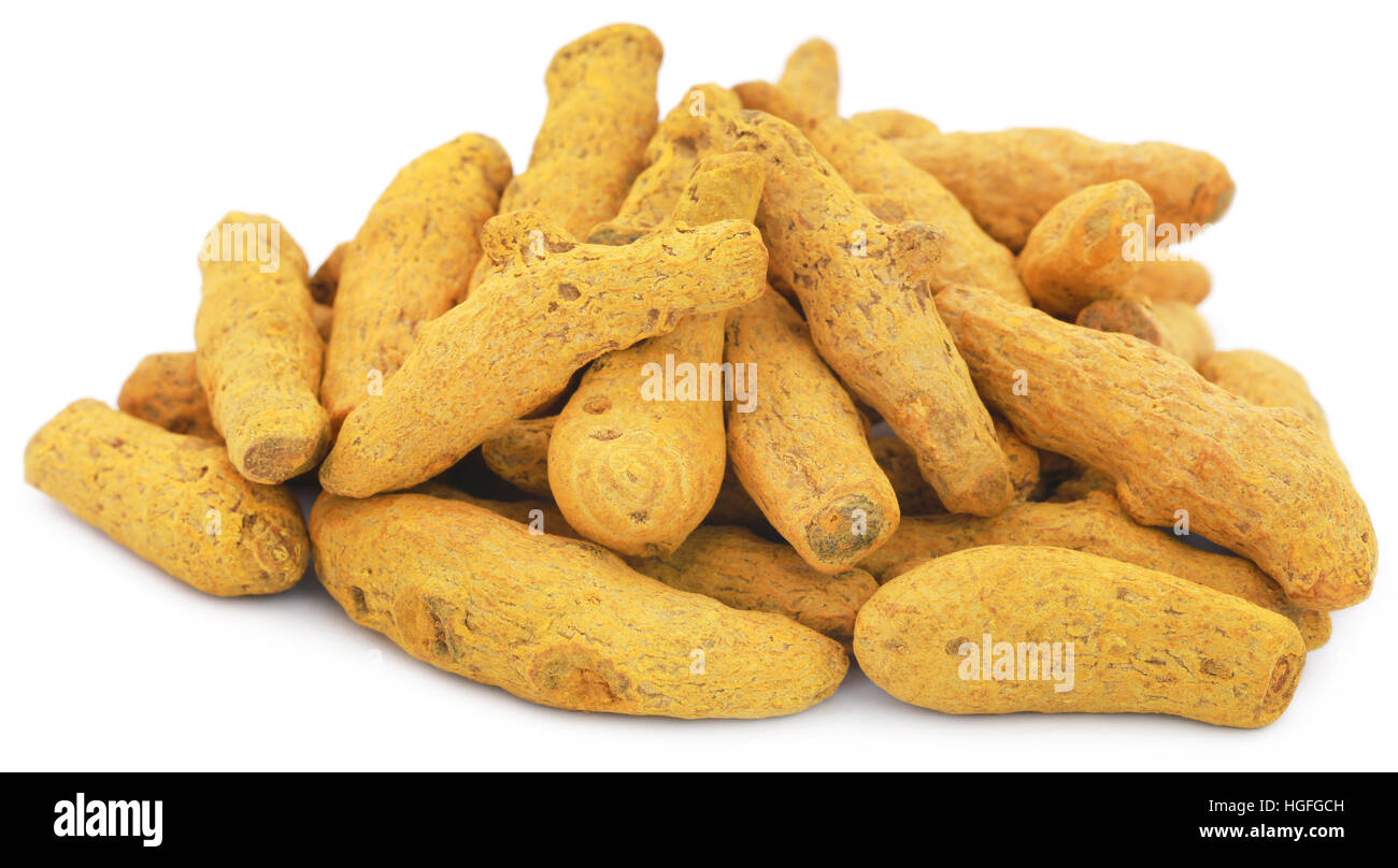 Dry turmeric over white background Stock Photo - Alamy