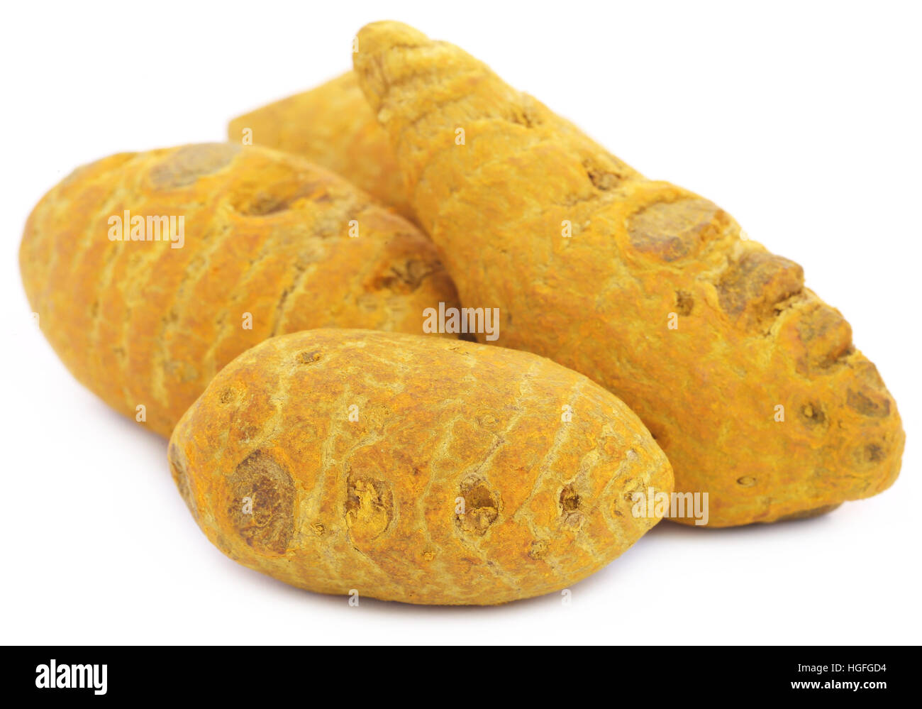 Dry turmeric over white background Stock Photo - Alamy