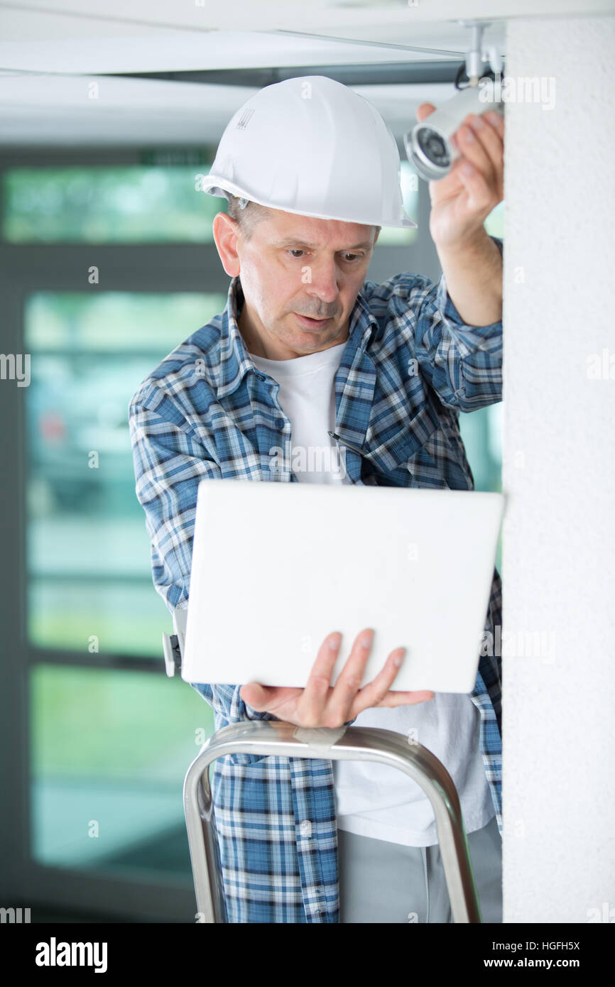 professional cctv technician working Stock Photo - Alamy