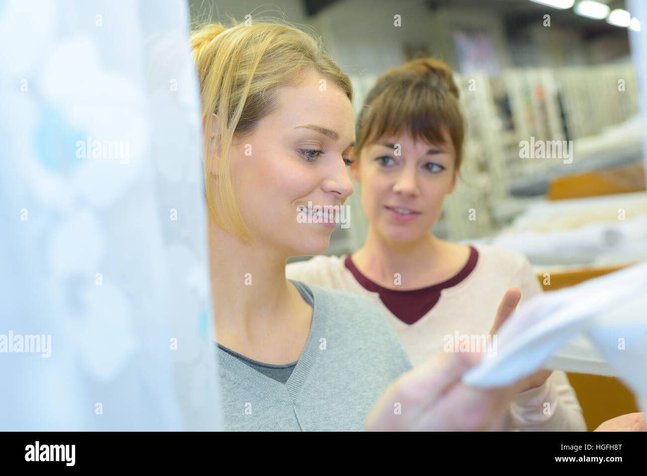 Women in material shop Stock Photo - Alamy