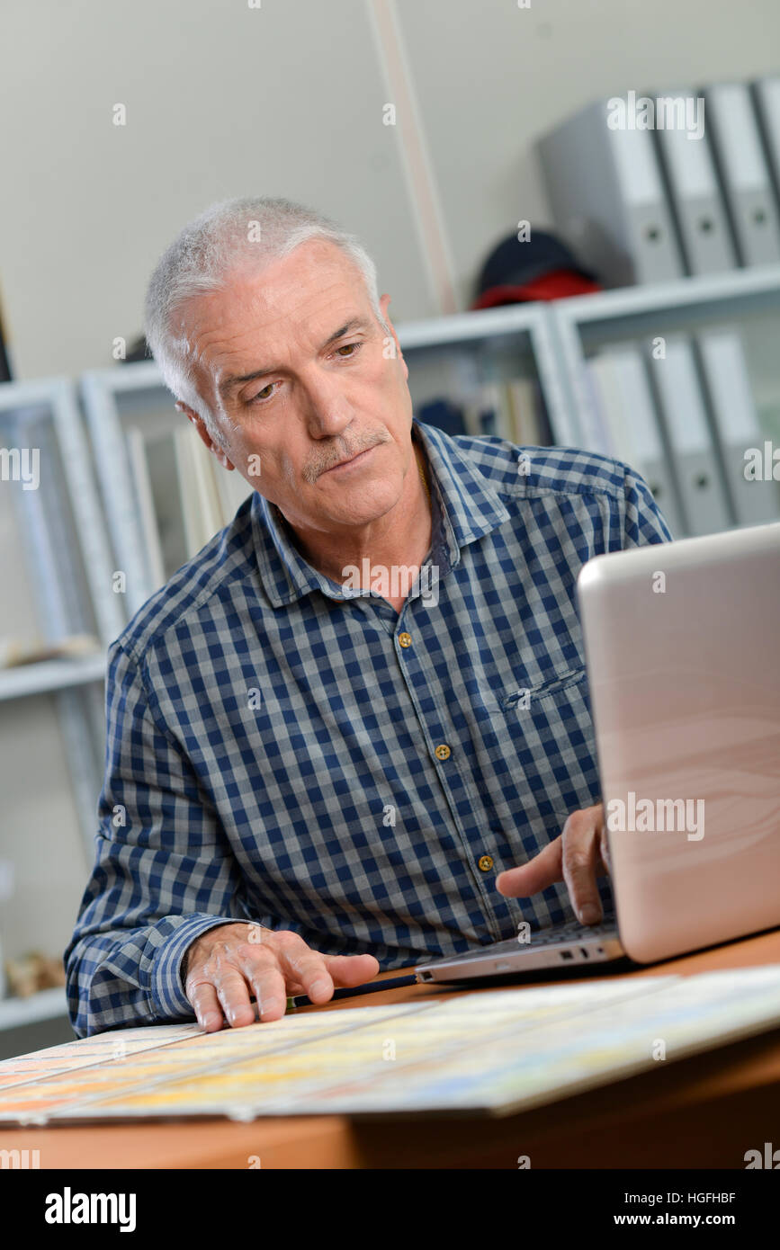 Senior office worker alone Stock Photo - Alamy