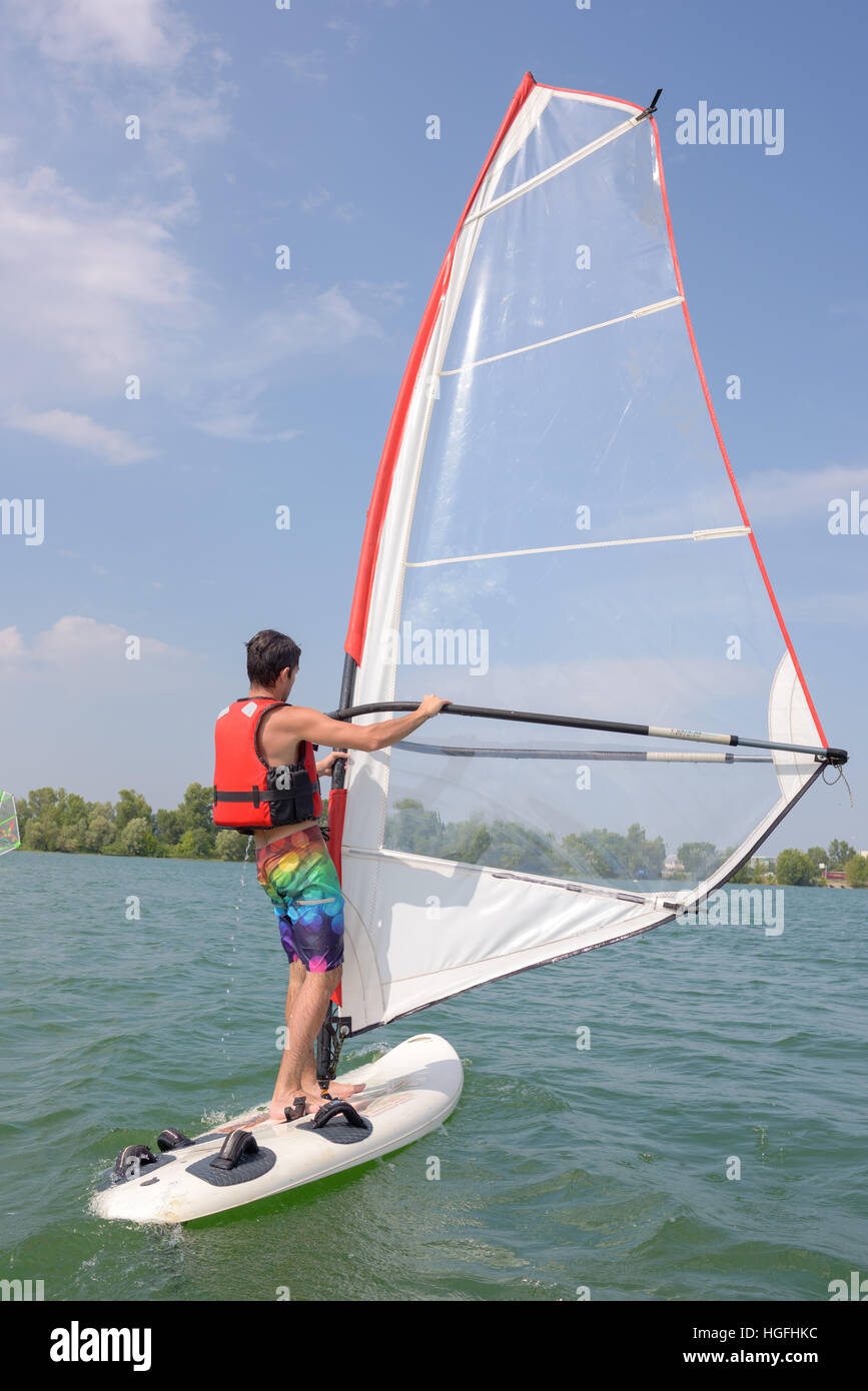Man on windsurfer Stock Photo - Alamy