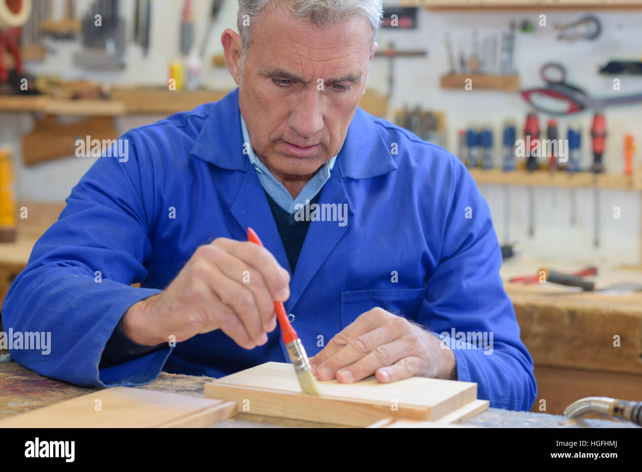 senior man working on his work bench Stock Photo - Alamy