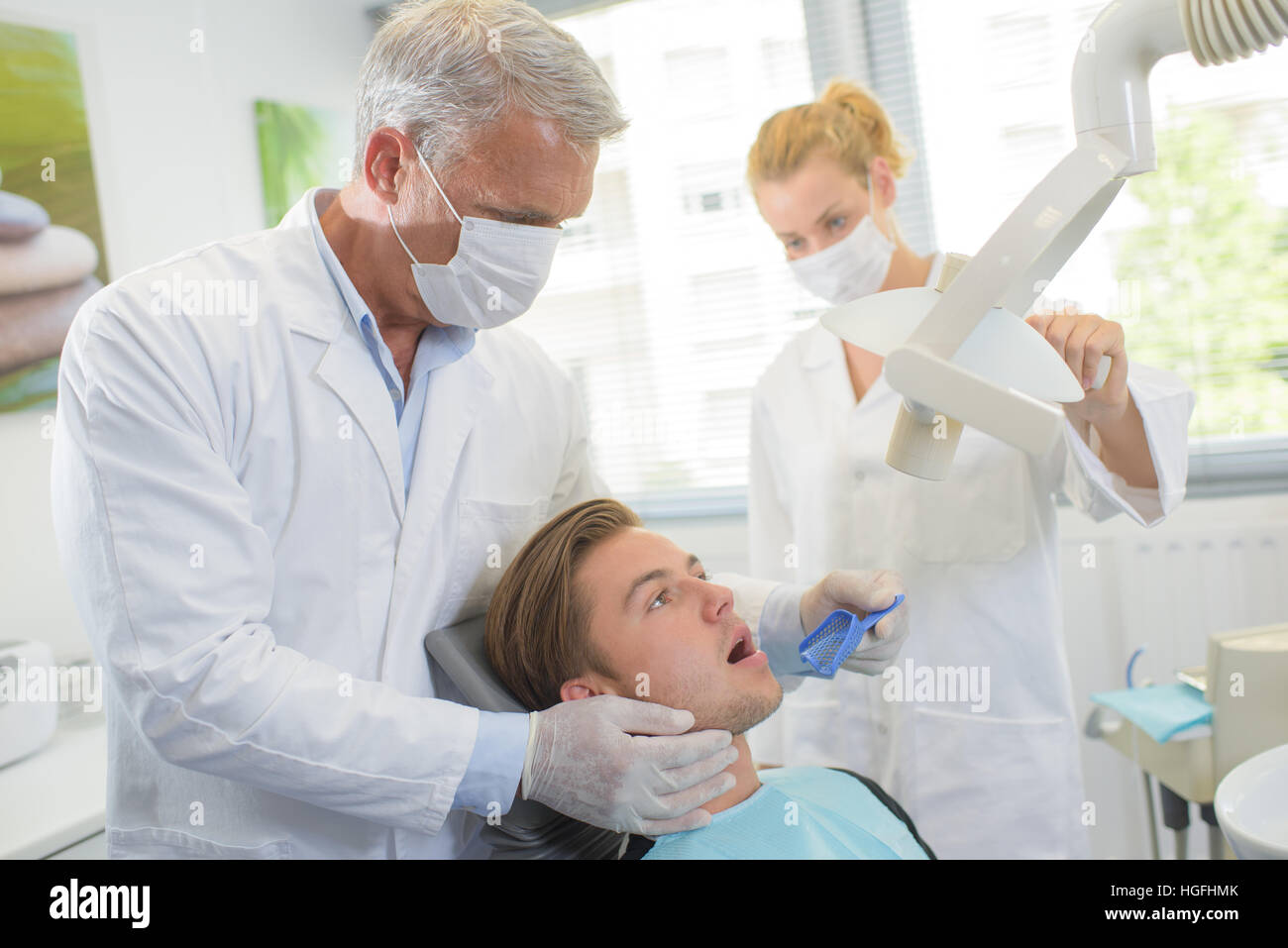 Dental treatment man hi-res stock photography and images - Alamy