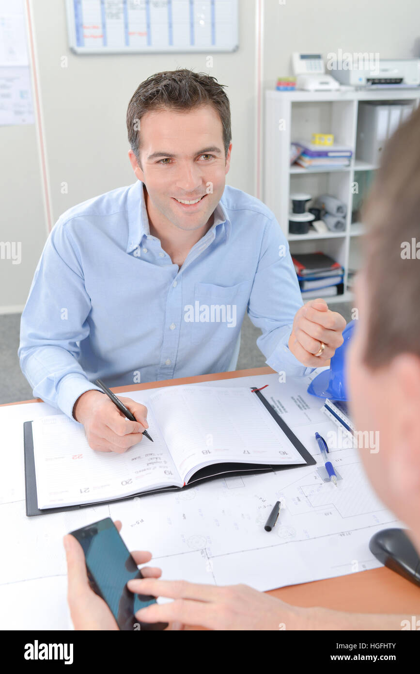 Writing during interview hi-res stock photography and images - Alamy