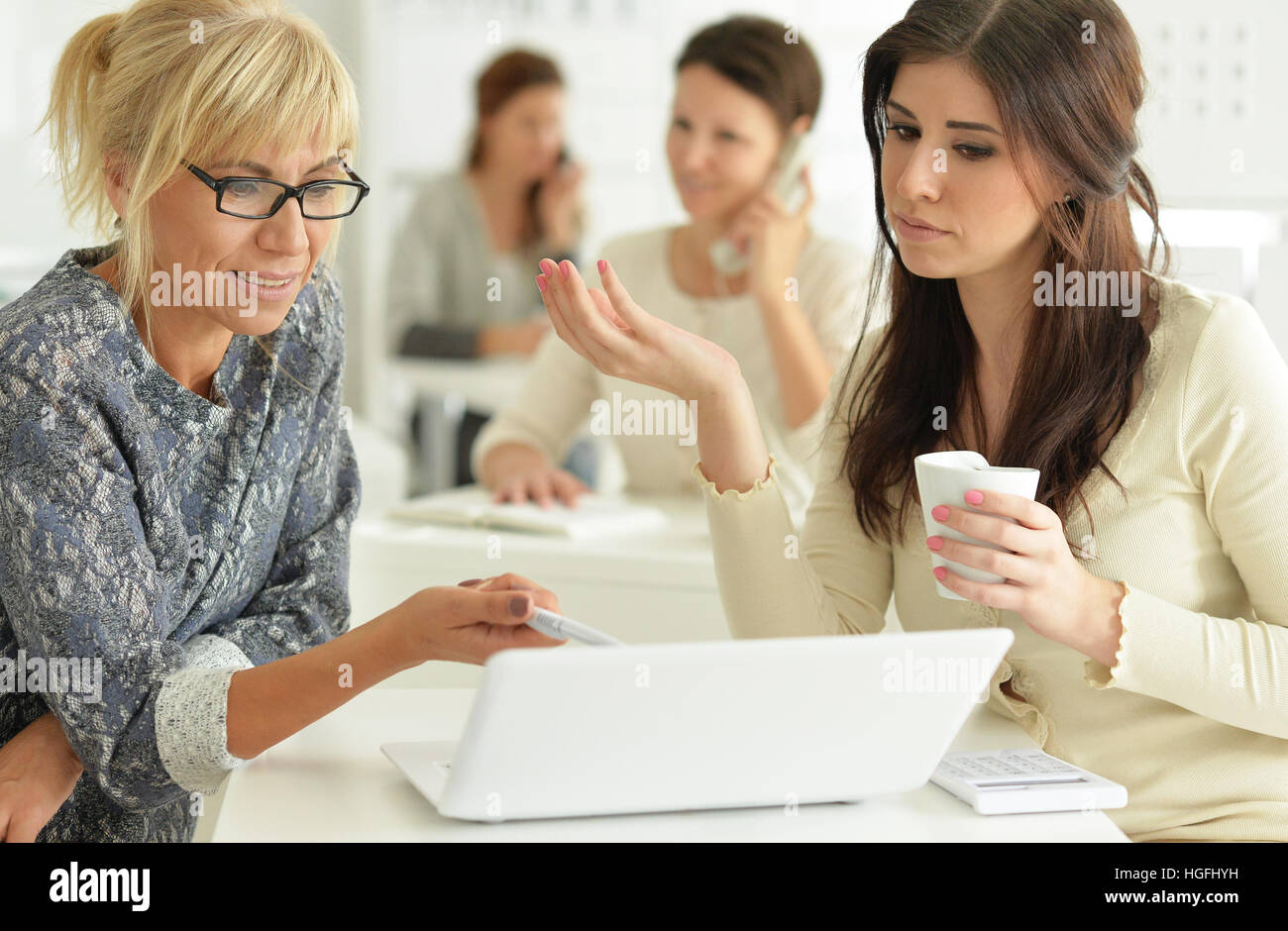 women working together in office Stock Photo - Alamy