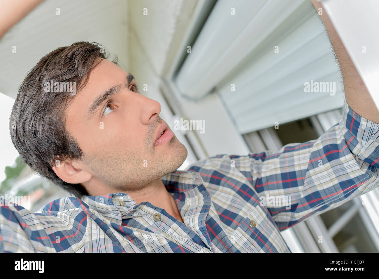 Installing a window Stock Photo - Alamy