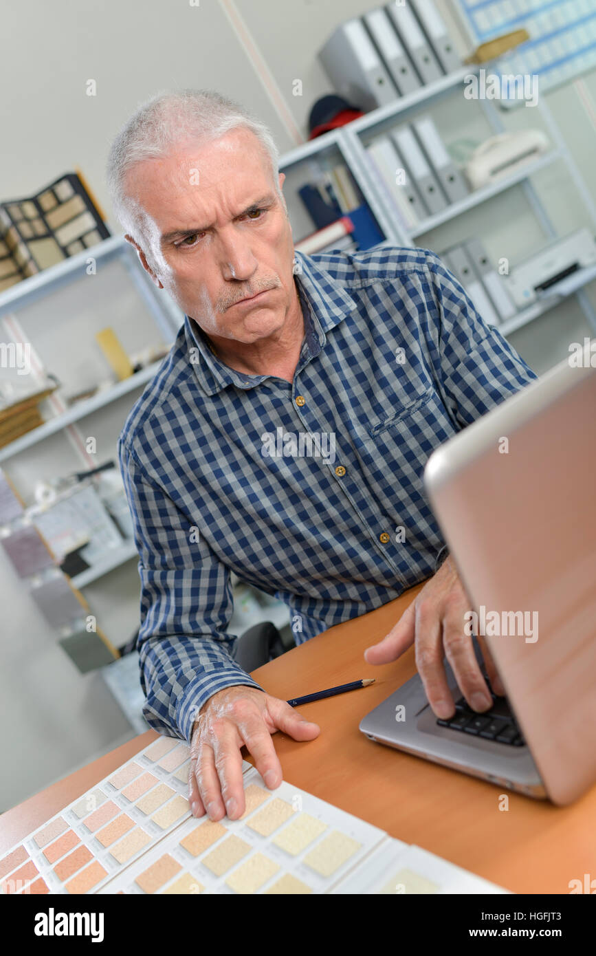 Worker selecting a color Stock Photo - Alamy Worker selecting a color Stock Photo - Alamy