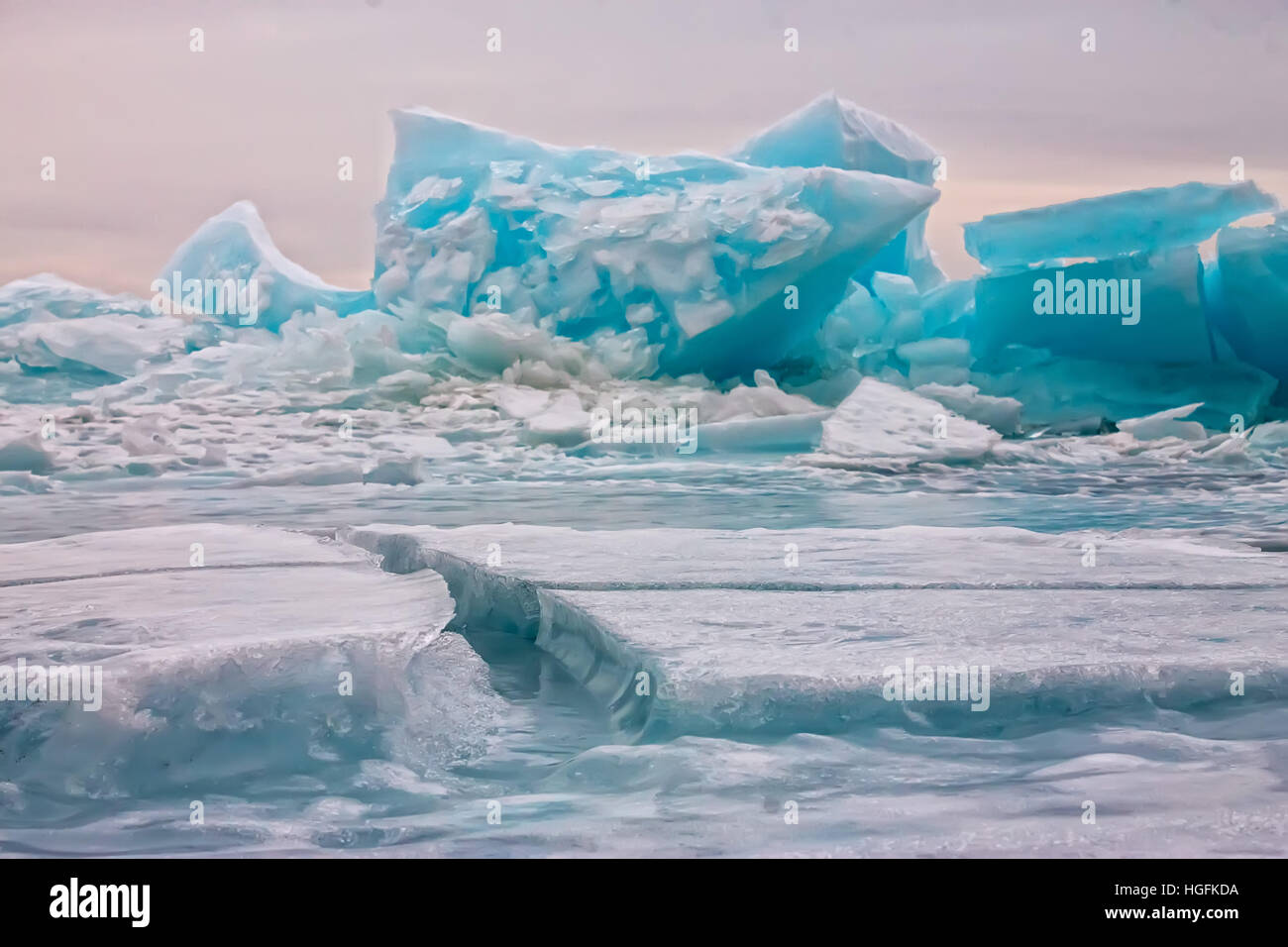 Arctic blue glacier ice hummock in cloudy weather Stock Photo - Alamy