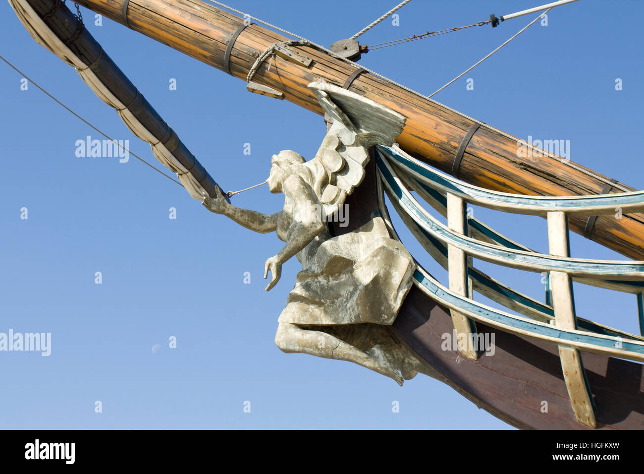 Sculpture of angel, decoration on sailing ship, standing on beach in ...