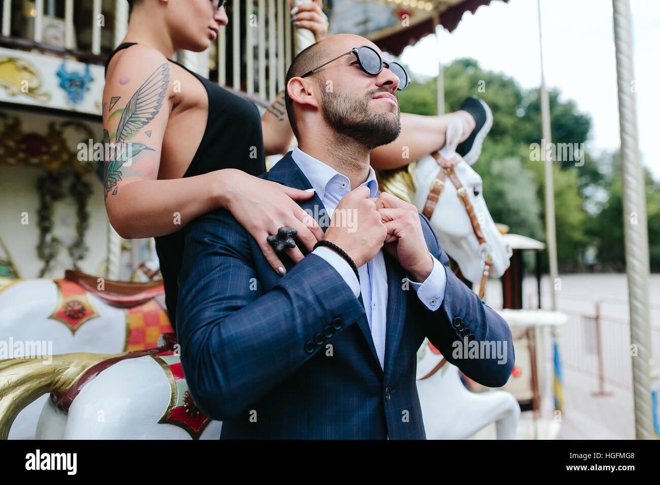 Young woman riding carousel hi-res stock photography and images - Alamy