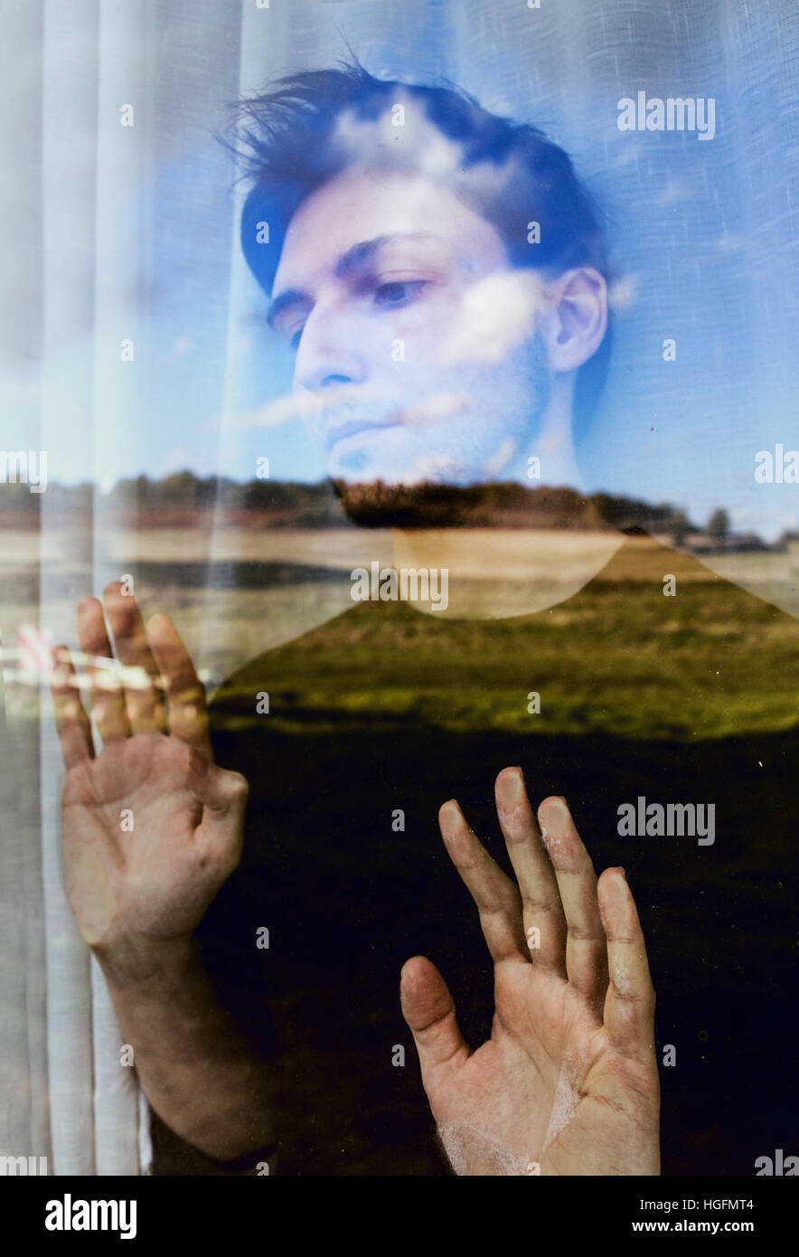 Young man dreaming with freedom looking through a window Stock Photo ...