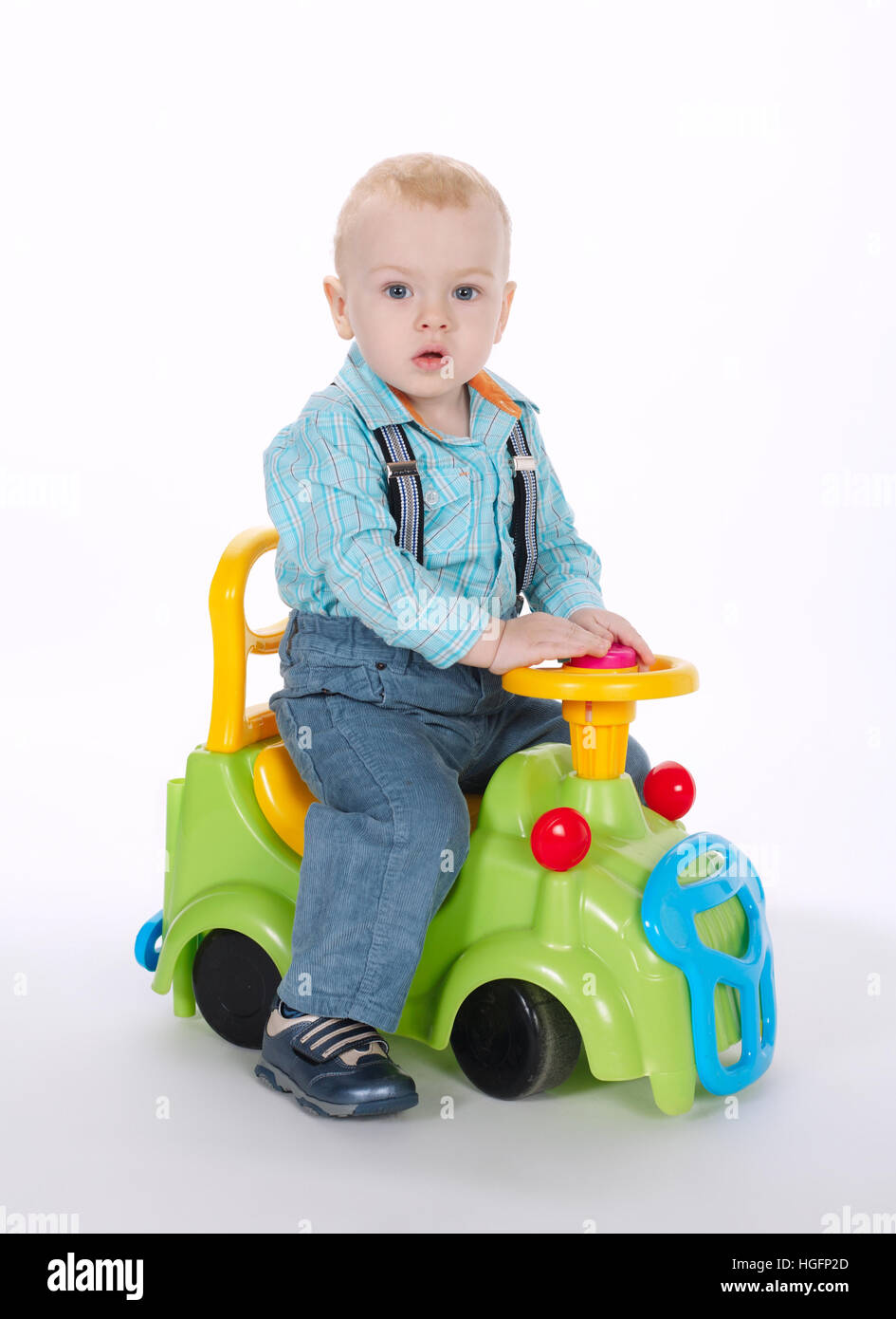 little boy driving on toy car Stock Photo - Alamy