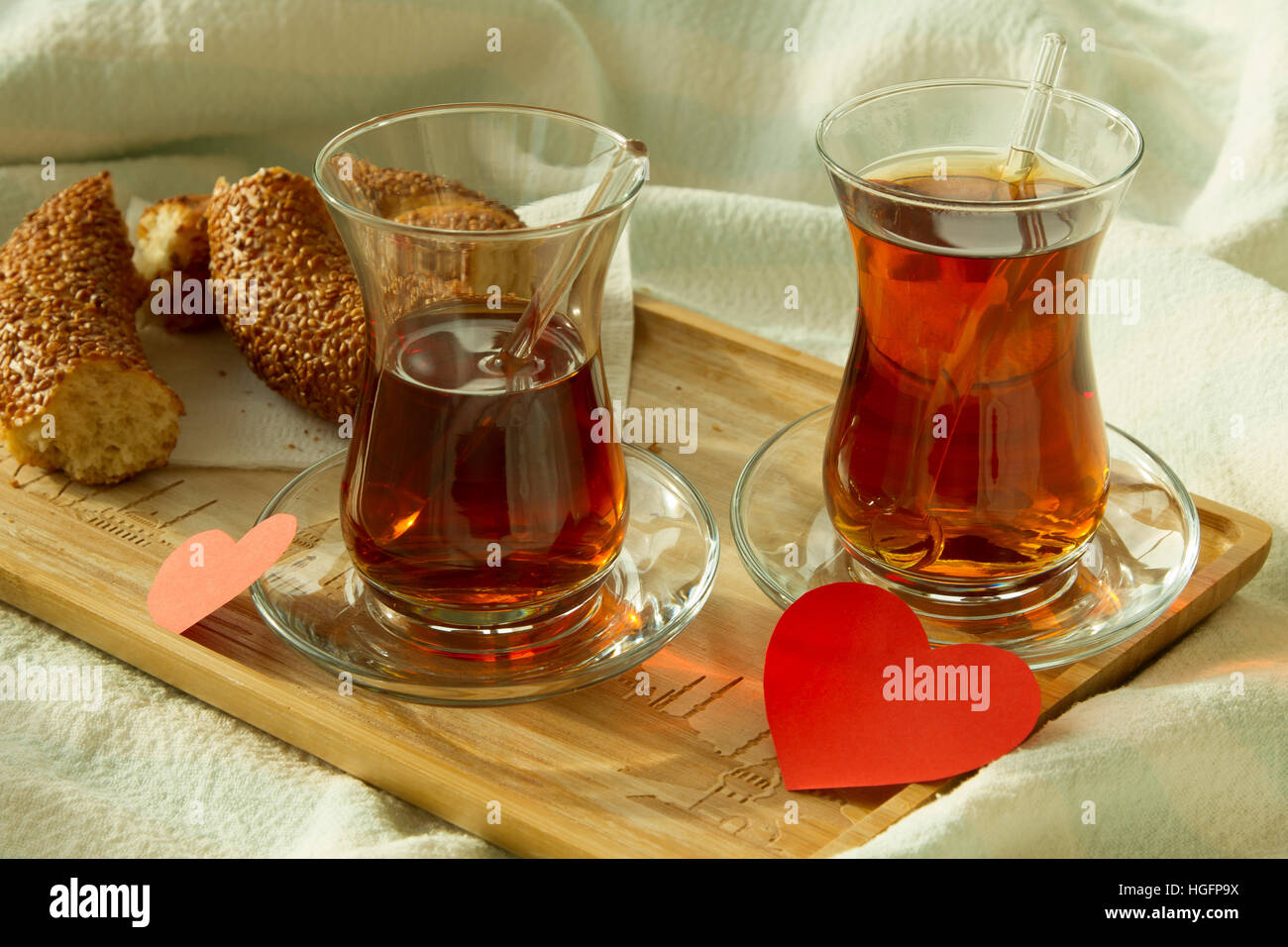 Morning turkish tea in traditional glass with bagel on the tray ...
