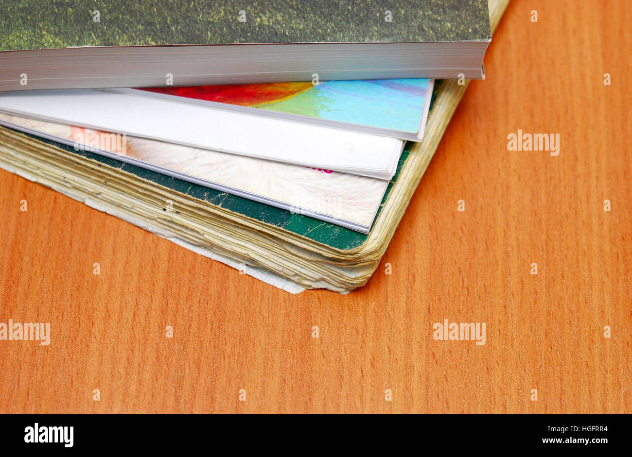 pile of old magazines on table (wood background Stock Photo - Alamy