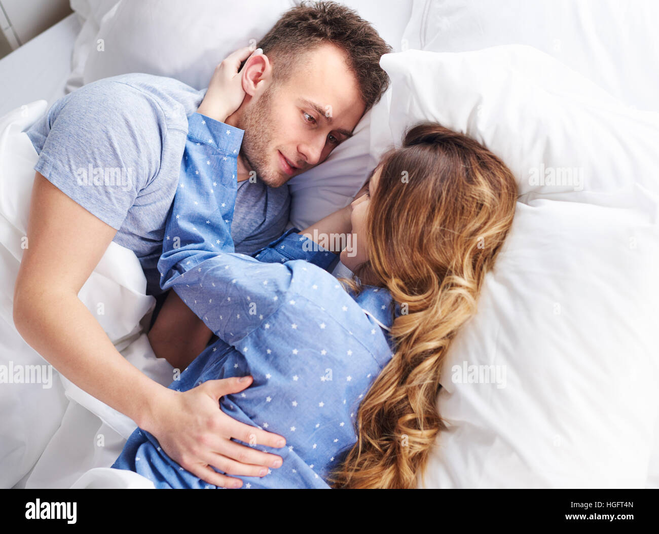 Snuggling in bed hi-res stock photography and images - Alamy