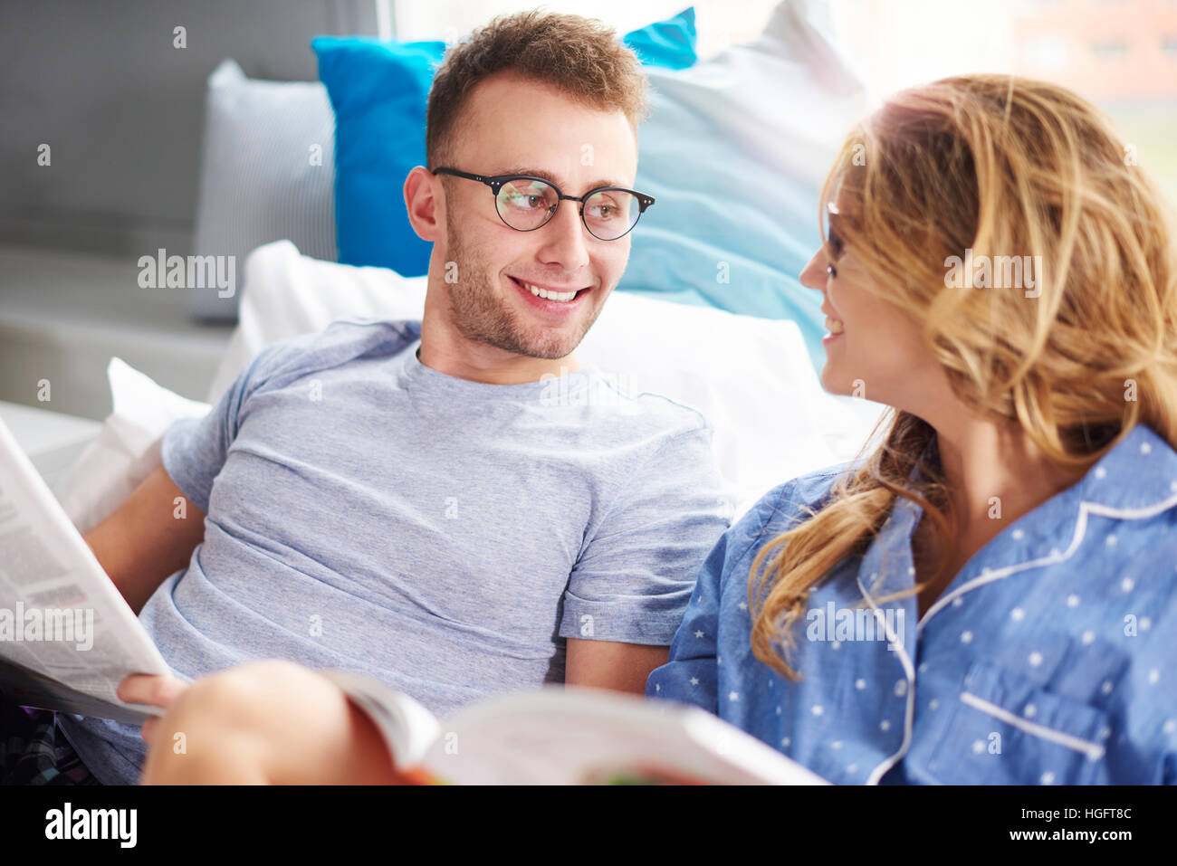 Morning reading newspapers in bed Stock Photo - Alamy