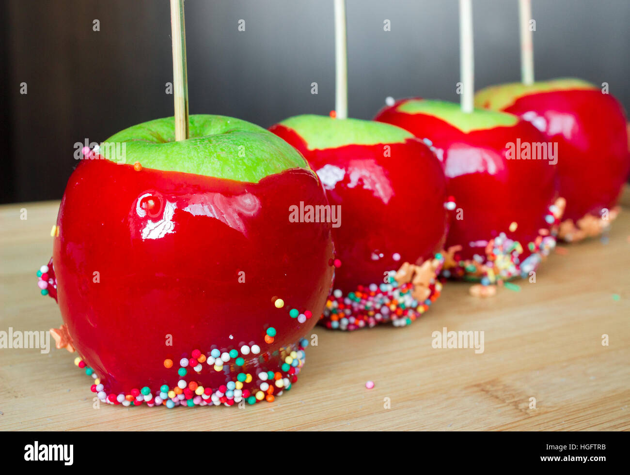 candy apples on wooden table Stock Photo - Alamy