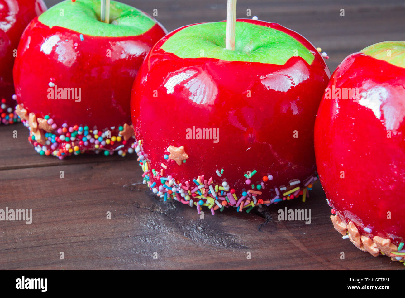 candy apples on wooden table Stock Photo - Alamy