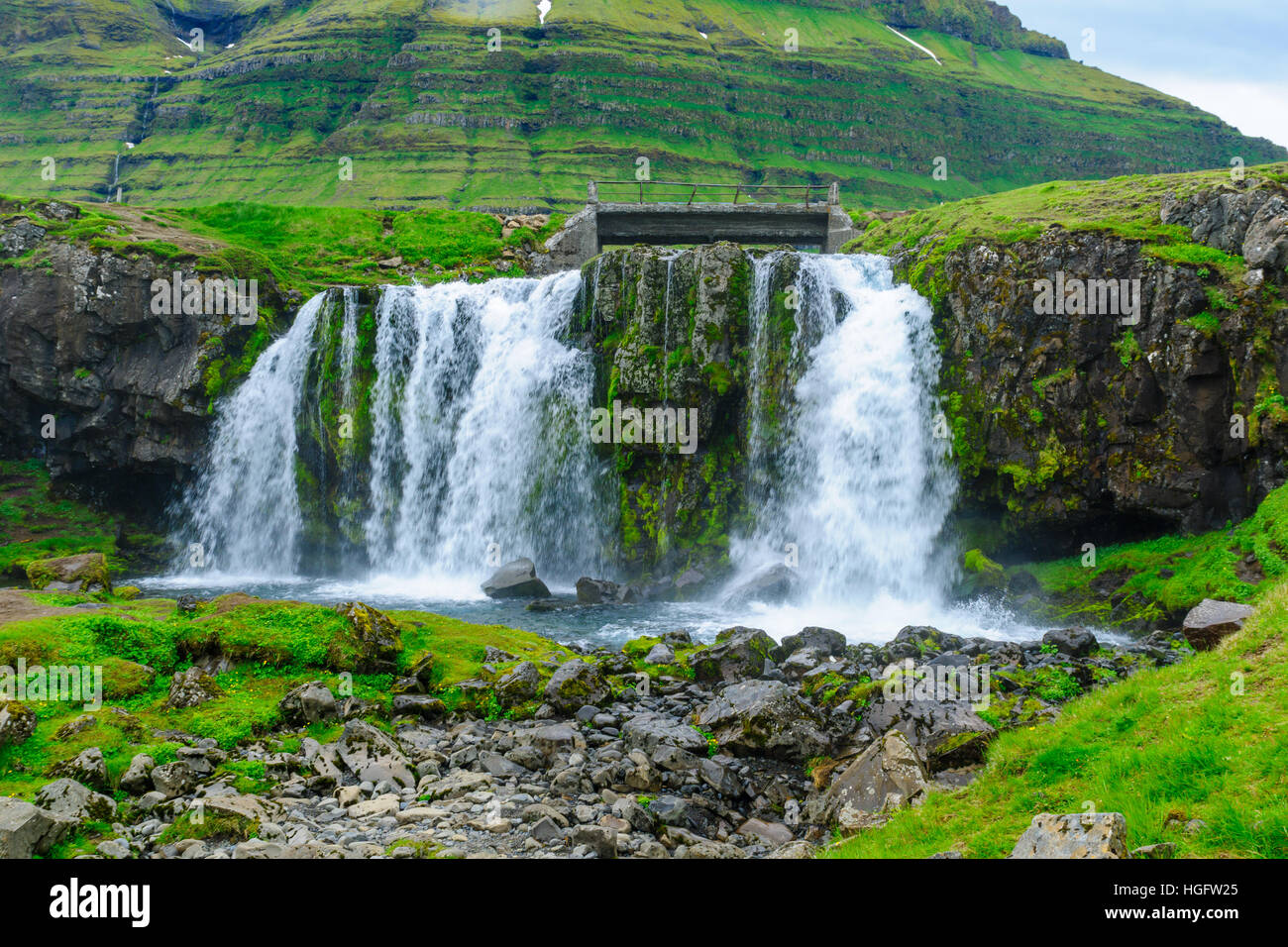 View of the Kirkjufellsfoss waterfalls, in the Snaefellsnes peninsula ...