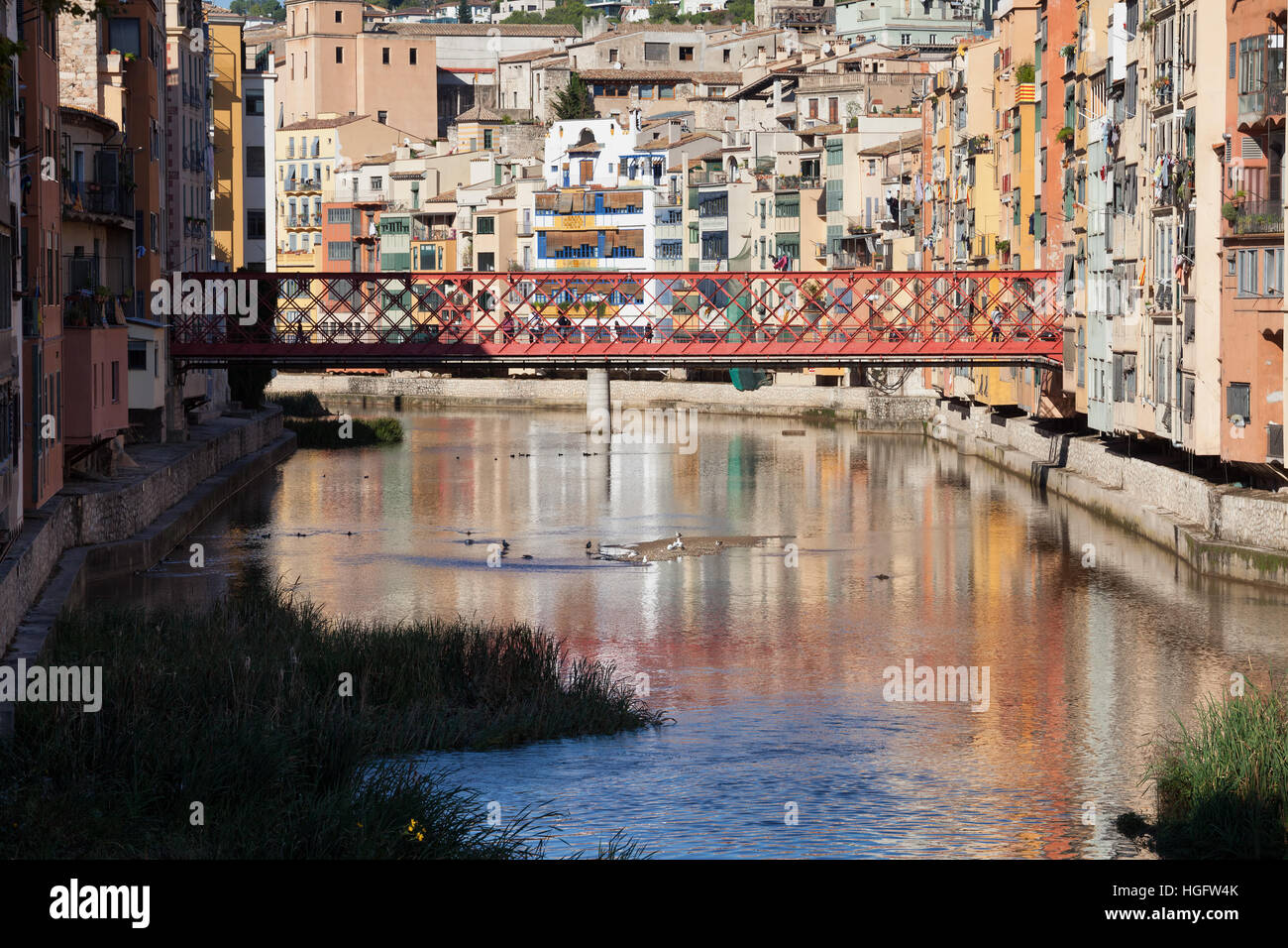Historic houses and the Eiffel Bridge over the Onyar River in Girona ...