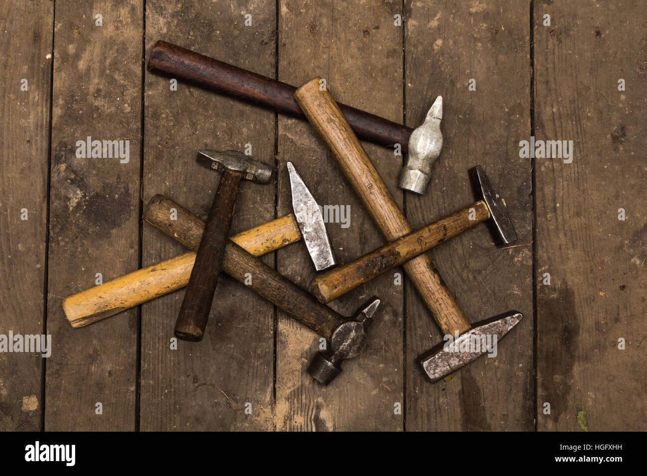 six hammers on wooden surface Stock Photo - Alamy