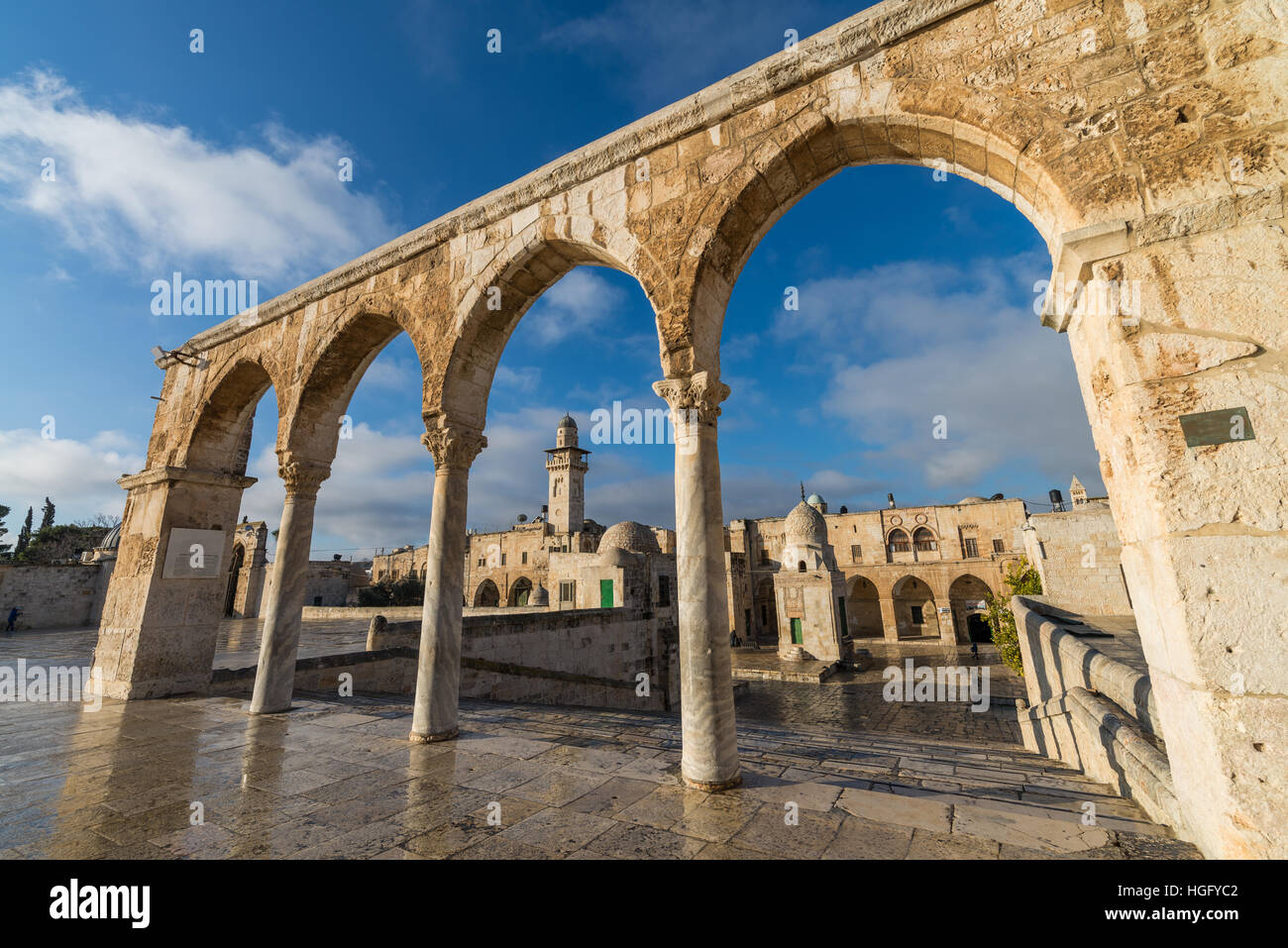 Ancient columns frame buildings, Temple Mount in the Old City of ...