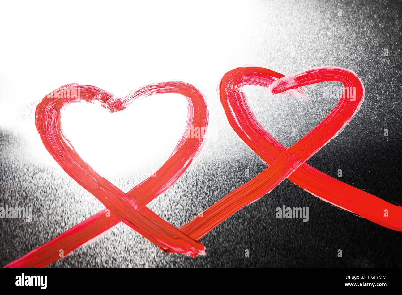 Two abstract red painted hearts on metal background Stock Photo - Alamy