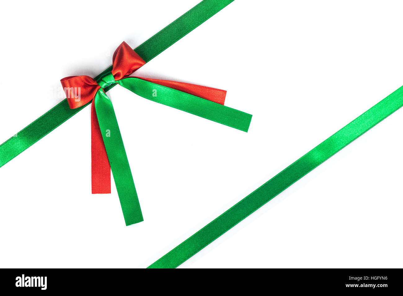Red and green ribbon bow isolated on white background Stock Photo - Alamy