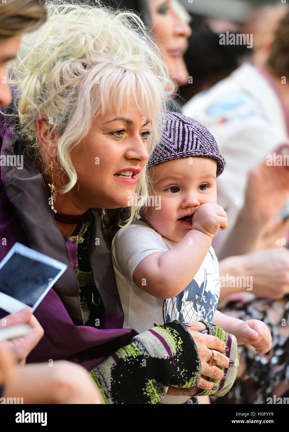 Jaime Winstone and her son Raymond on the front row before the Vivienne ...