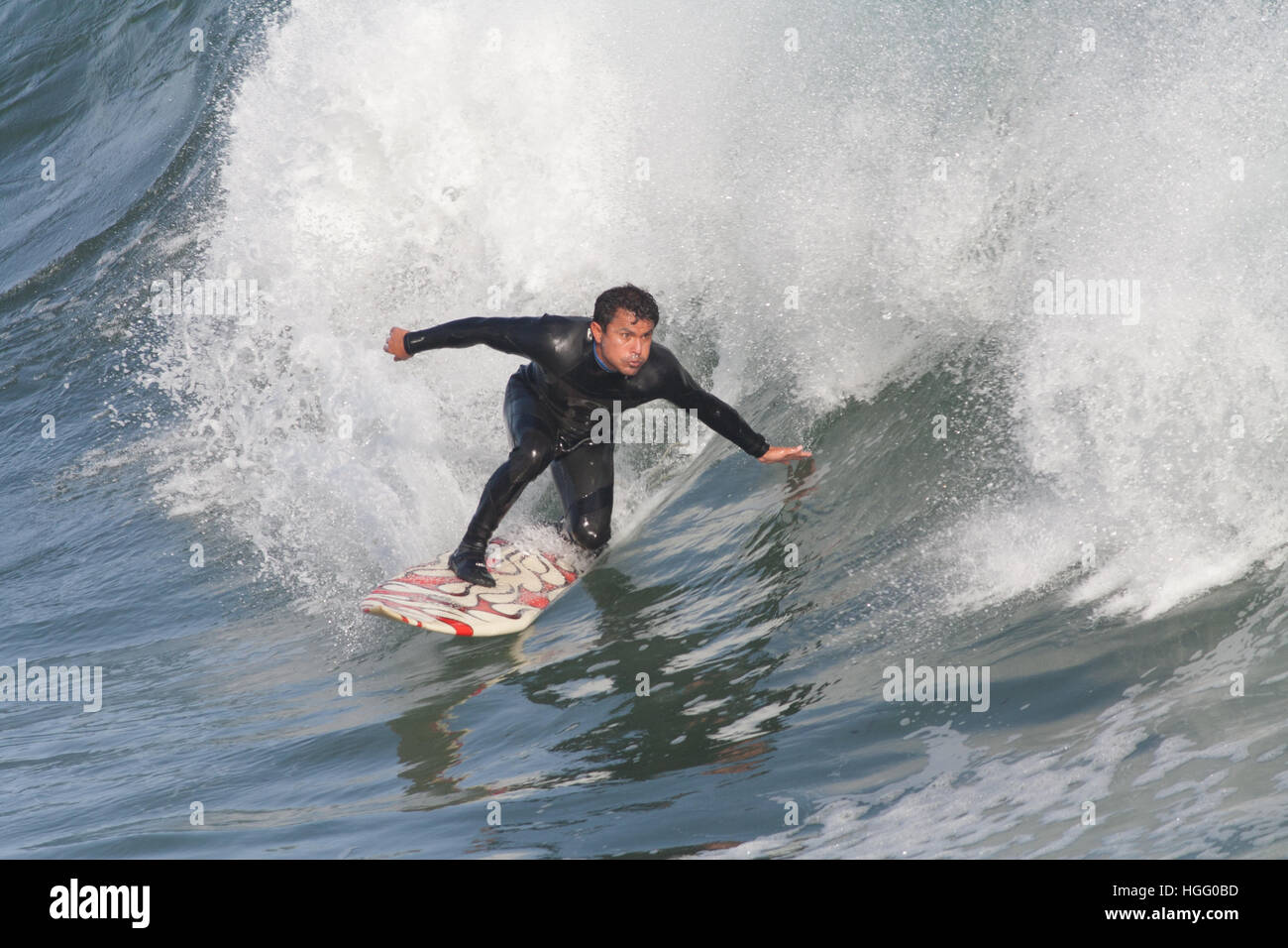 Surfer riding a wave Stock Photo - Alamy