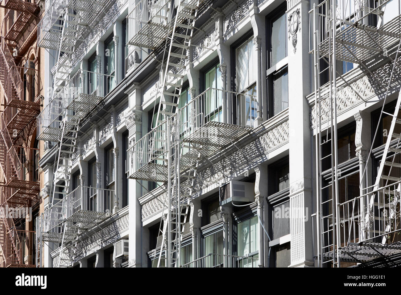 New York buildings with fire escape stairs, sunny day in Soho Stock ...