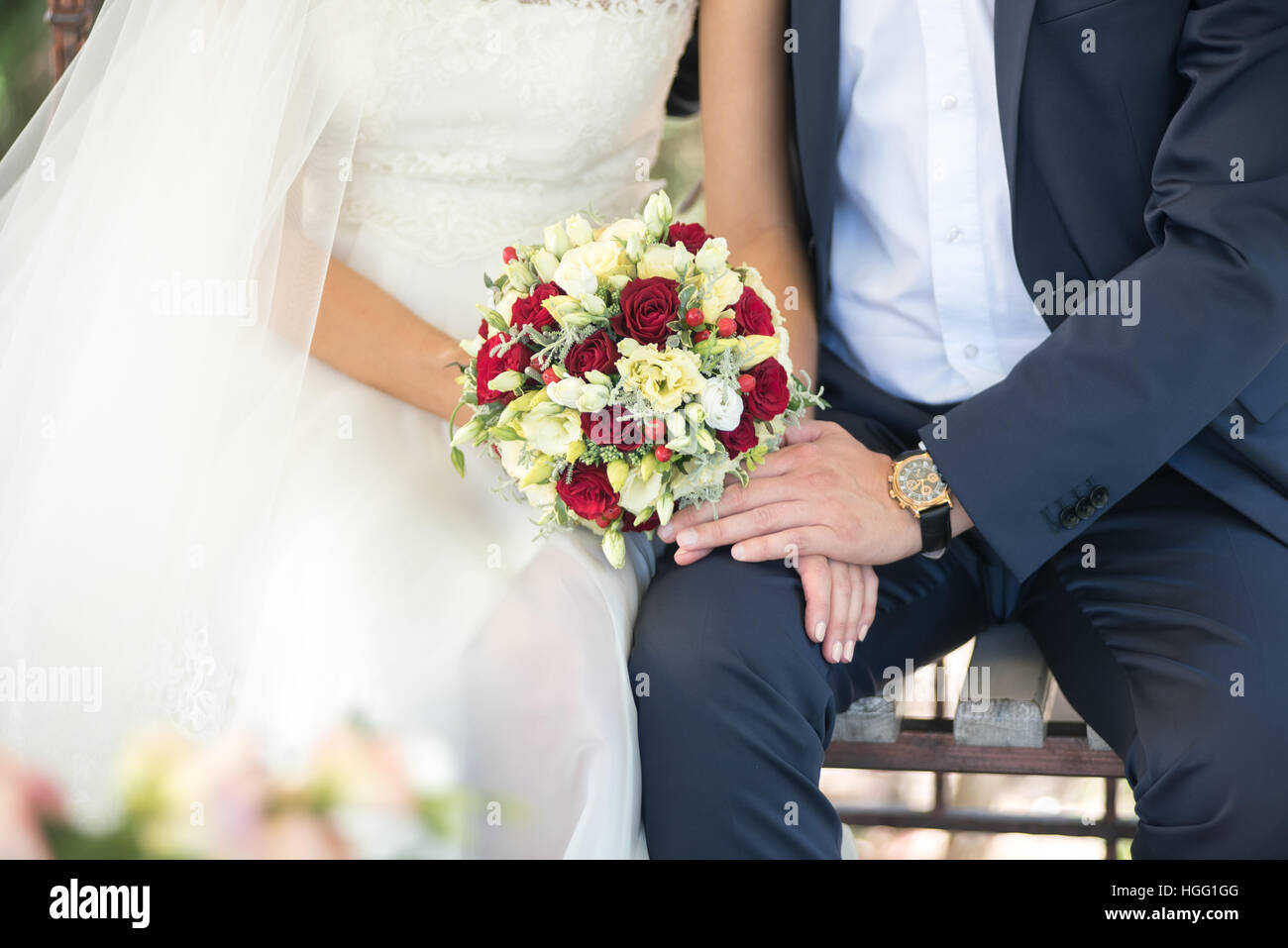Bride and groom's hands at wedding ceremony Stock Photo - Alamy