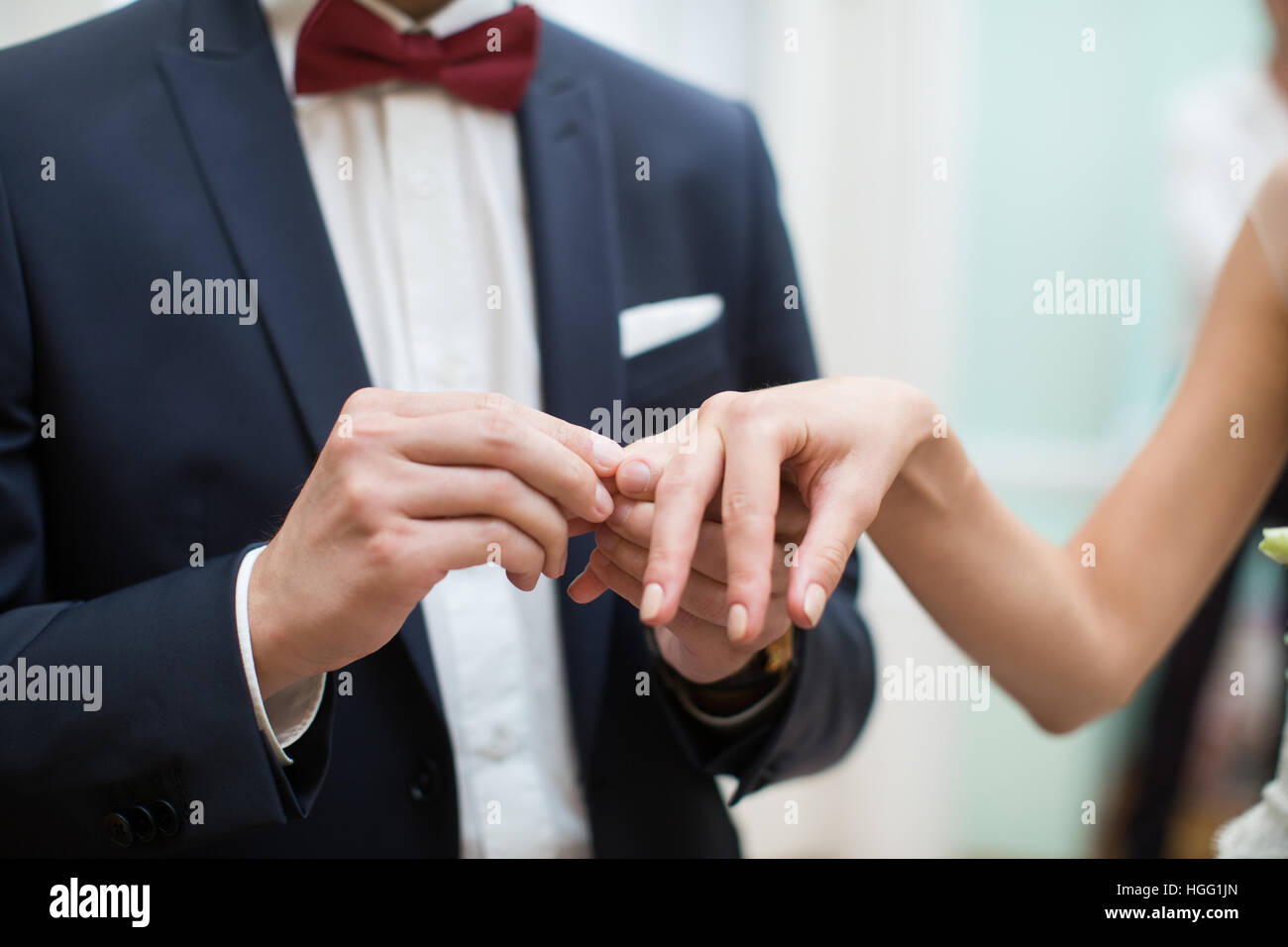 bride and groom are changing rings on wedding ceremony Stock Photo - Alamy