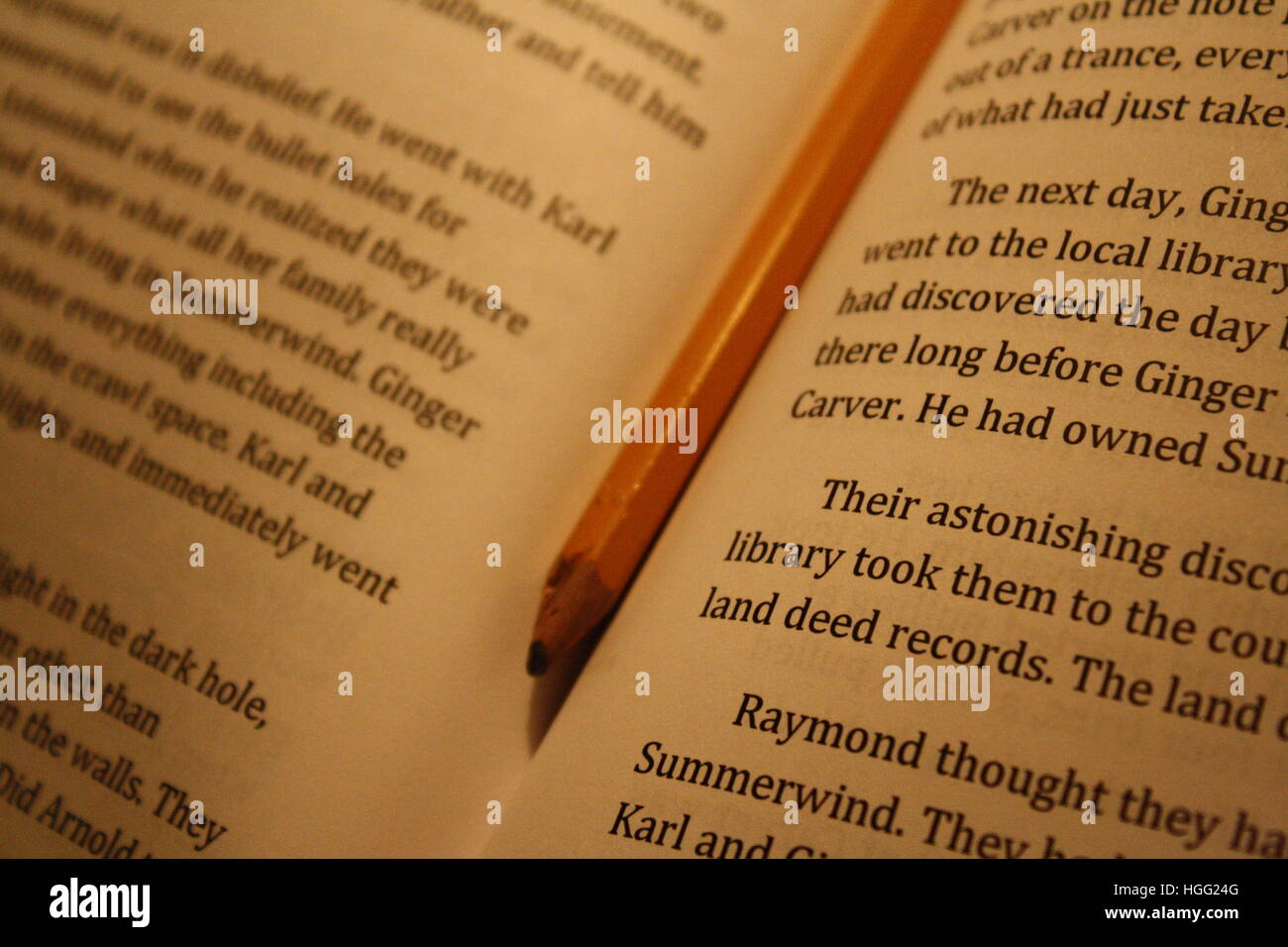 Pencil in Open Book Stock Photo - Alamy