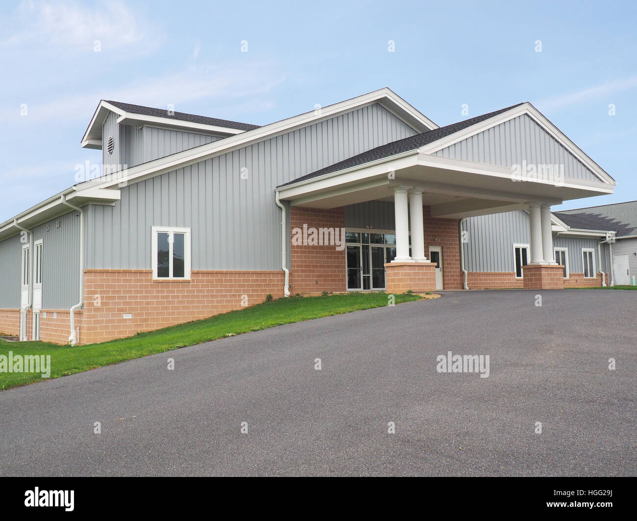 modern building with vinyl and brick exterior. Building is by large ...