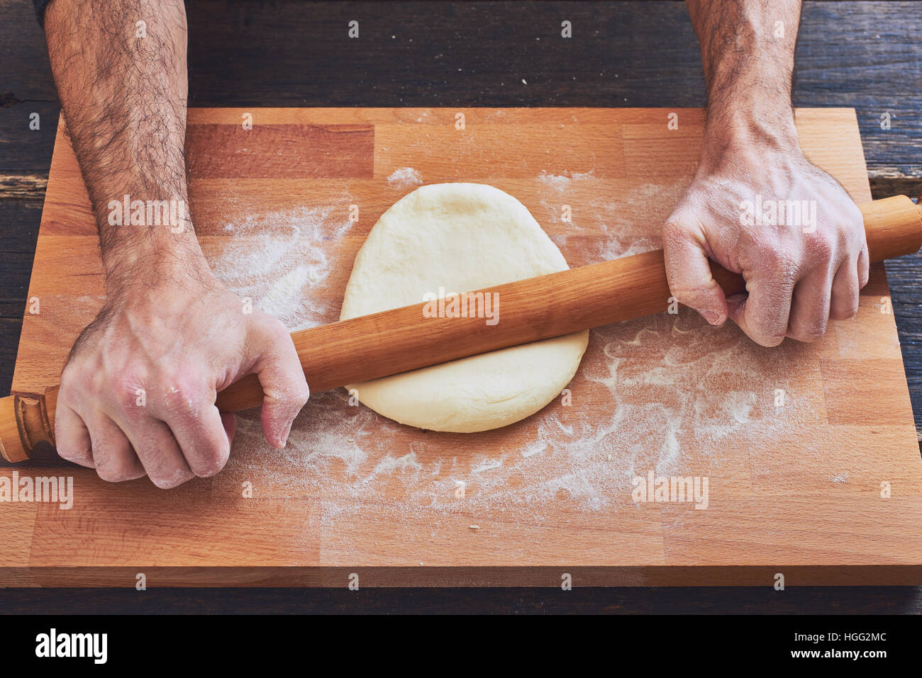 Making handmade pasta with wooden rolling pin Stock Photo - Alamy