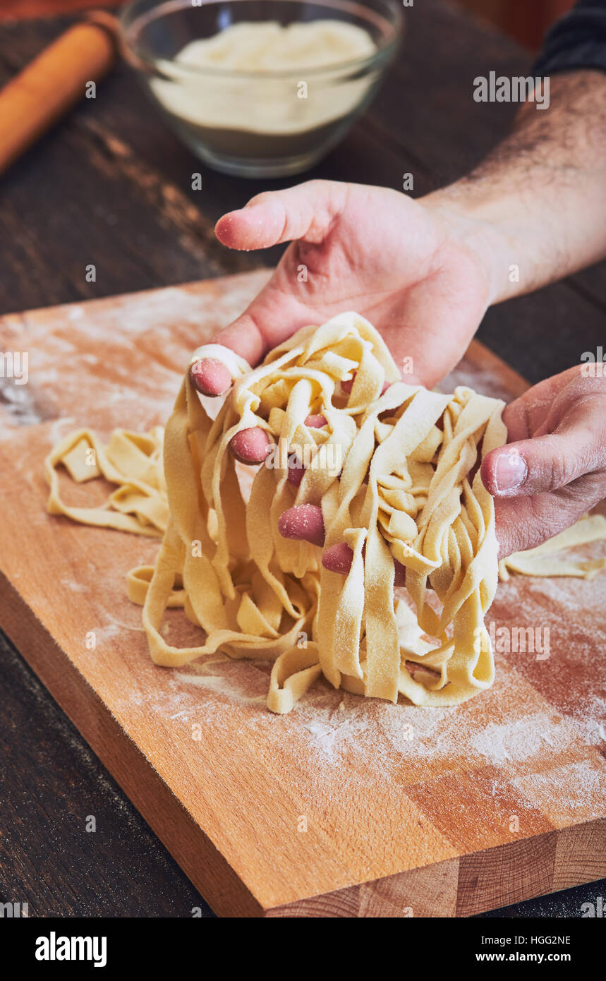 Male hands preparing pasta hi-res stock photography and images - Alamy