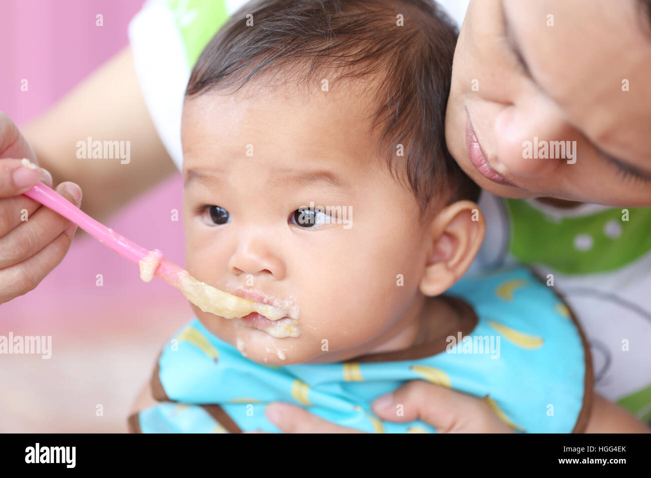 Asian baby boy to eating food in concept of health foods and nutrition ...