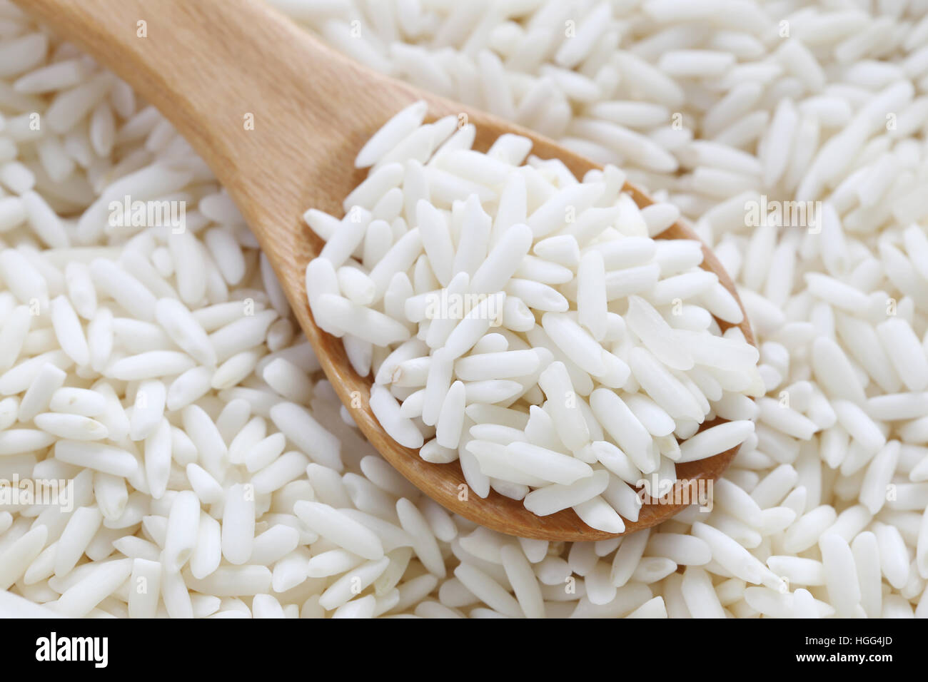 Organic white rice in wooden spoon, glutinous rice or sticky rice for ...