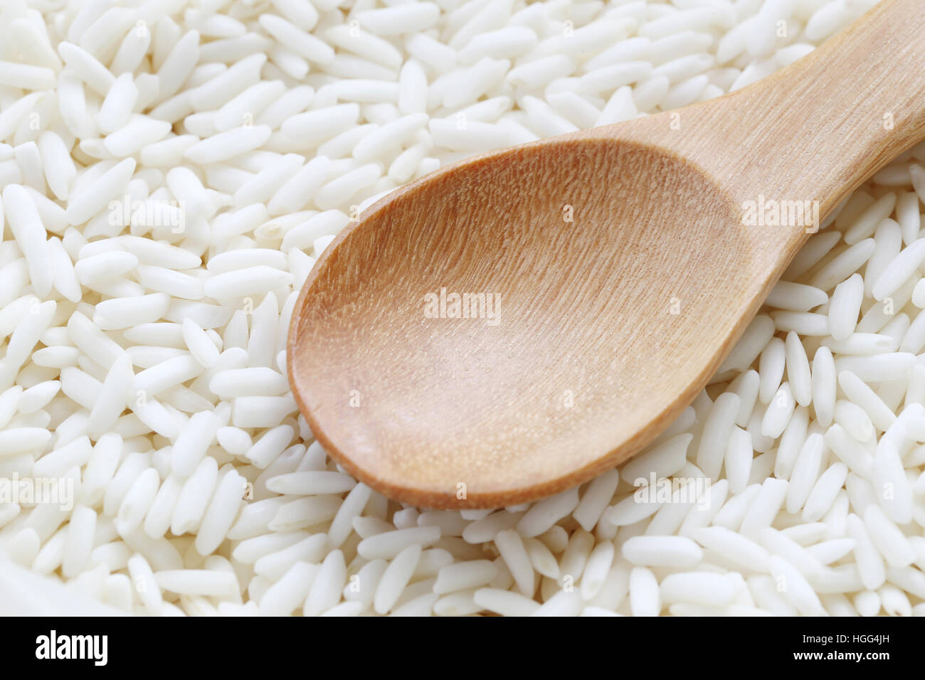 Wooden spoon of empty on organic white rice, glutinous rice or sticky ...