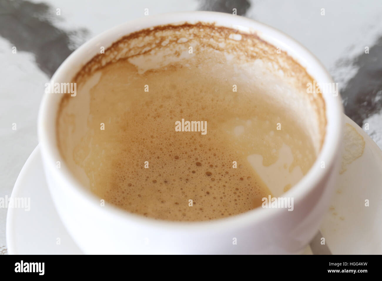 White coffee mug with coffee stains on table in a cafe Stock Photo - Alamy