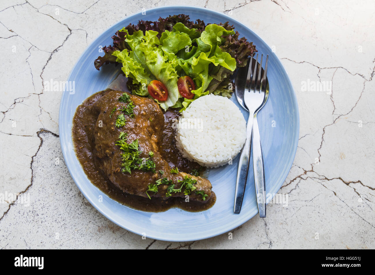 roasted chicken leg with rice and vegetable Stock Photo - Alamy
