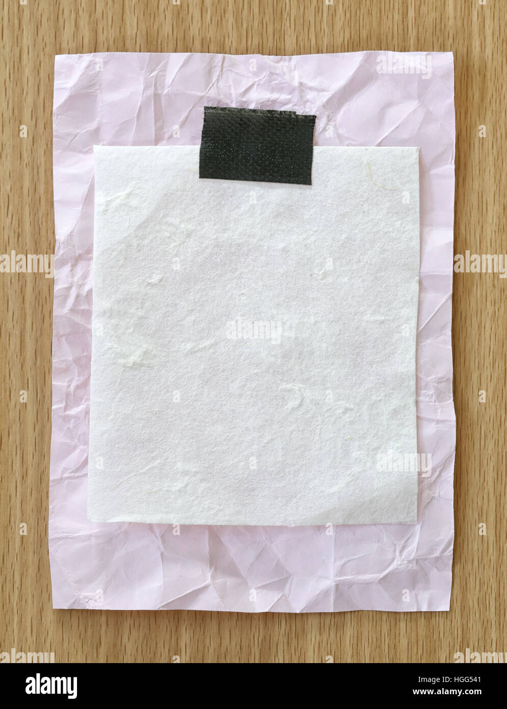 Pink notepad paper crumpled of empty and copy space on wooden ...