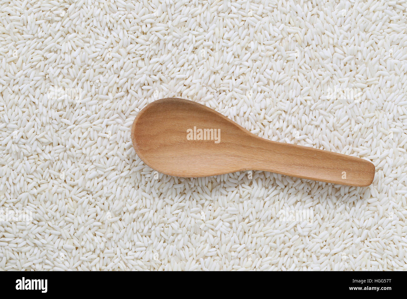 Wooden spoon of empty on organic white rice, glutinous rice or sticky ...