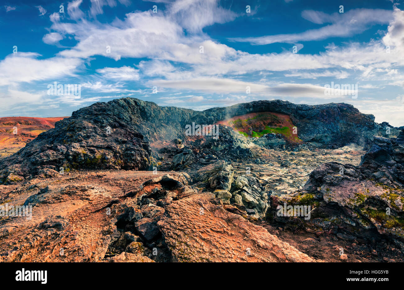 Fields of steamy waters in the Krafla volcano. Colorful exotic ...